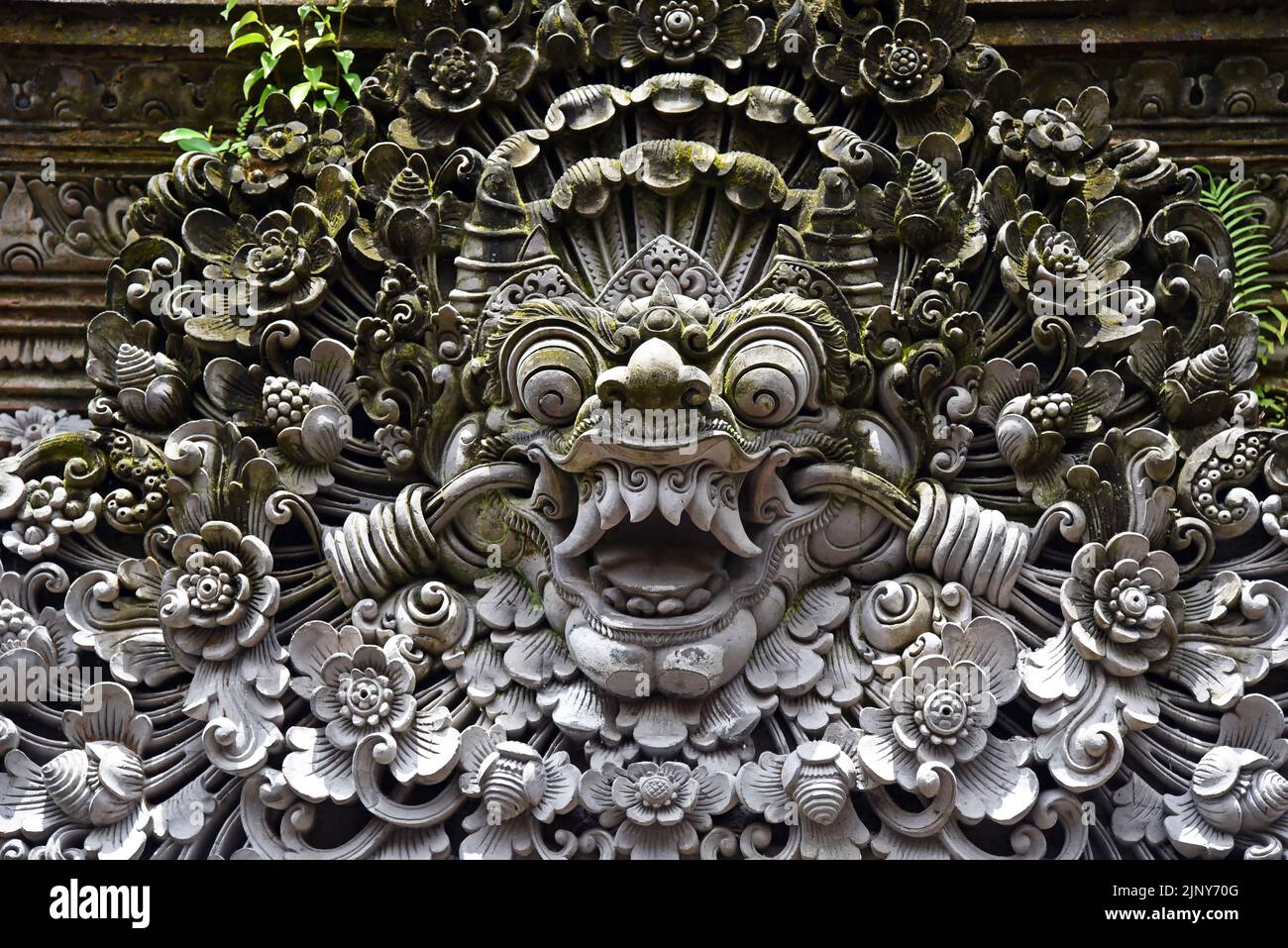 Bali deity Demon Barong Face stone carving Stock Photo - Alamy