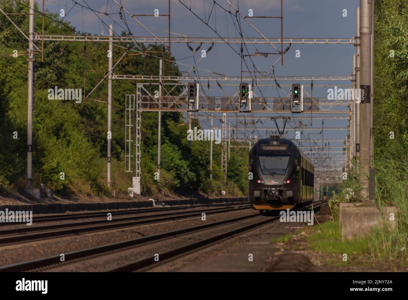 Trains on main czech railway Prague Kolin in summer hot sunny evening ...