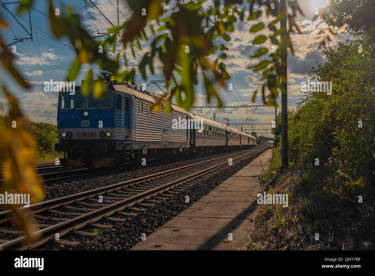 Trains on main czech railway Prague Kolin in summer hot sunny evening ...