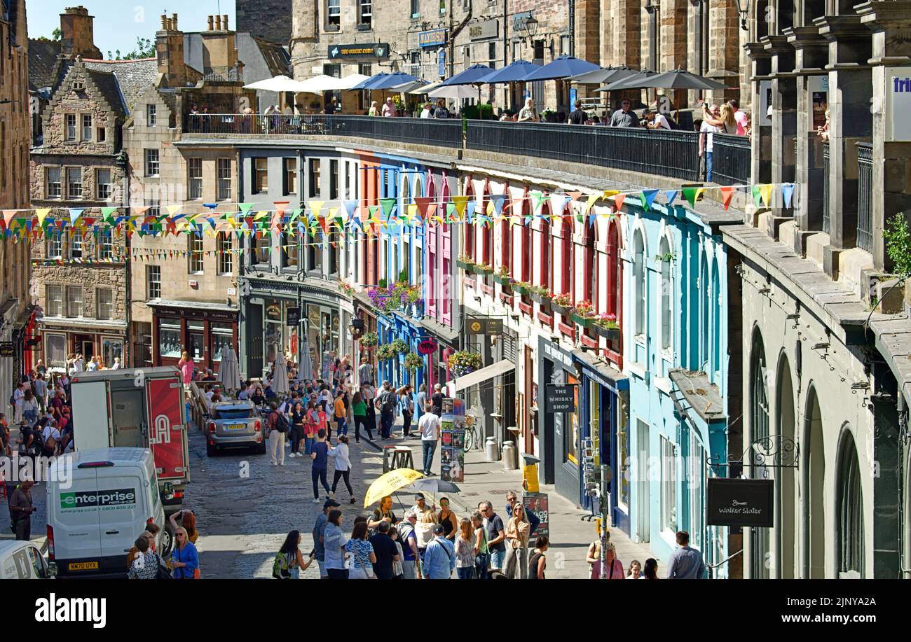 EDINBURGH CITY SCOTLAND FESTIVAL MONTH THE COLOURED SHOP FRONTS OF A ...
