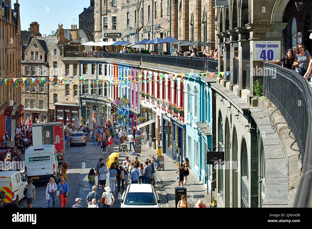 EDINBURGH CITY SCOTLAND FESTIVAL MONTH THE COLOURED SHOP FRONTS OF A ...