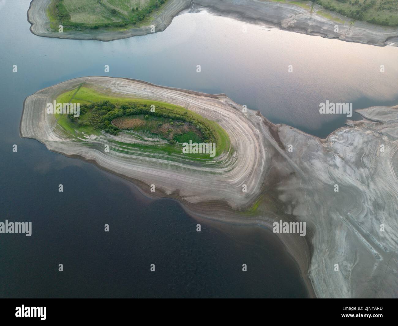 Drought conditions are shown through drone shots of Stocks Reservoir ...