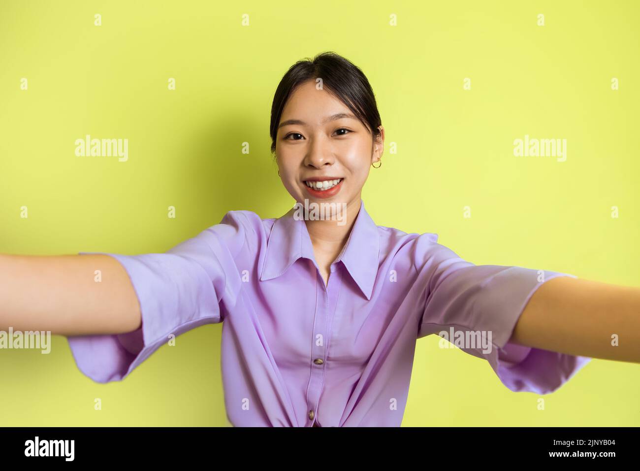 Happy Asian Lady Making Selfie Posing Standing Over Yellow Background ...