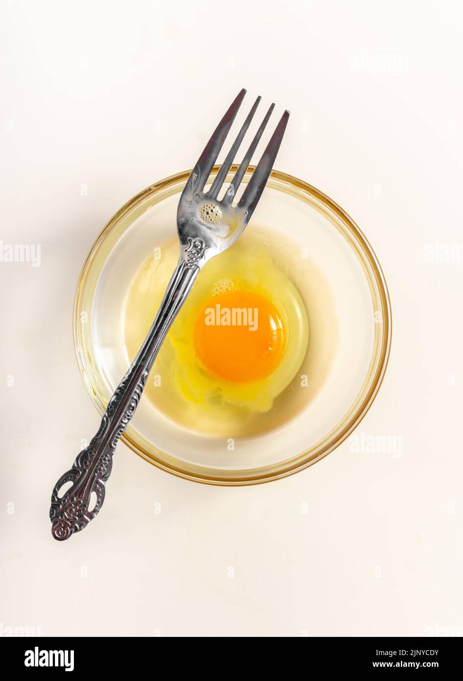 Raw eggs. Close up. flat lay raw eggs yolk in bowl. Isolated broken ...