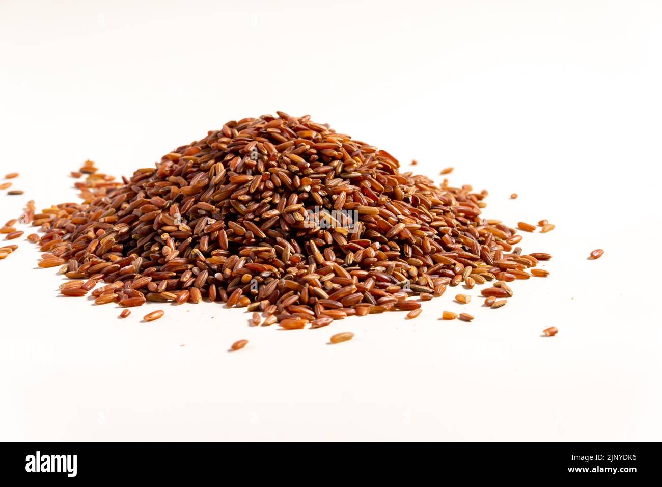 raw red rice isolated on white Stock Photo - Alamy