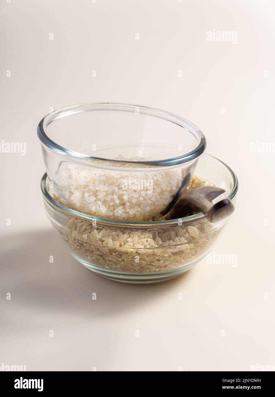 brown rice dan white rice in two glass bowls Stock Photo - Alamy