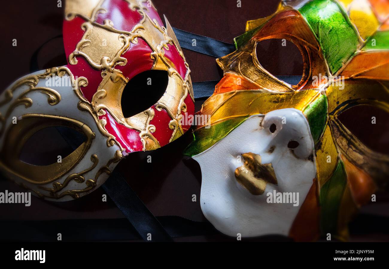 Two Italian masks, hand painted Stock Photo - Alamy