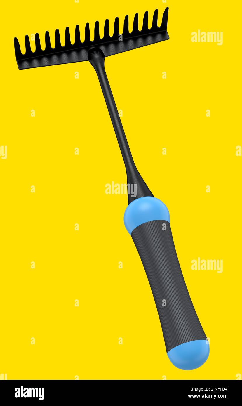 Garden rake with wooden handle for harvesting hay isolated on yellow ...