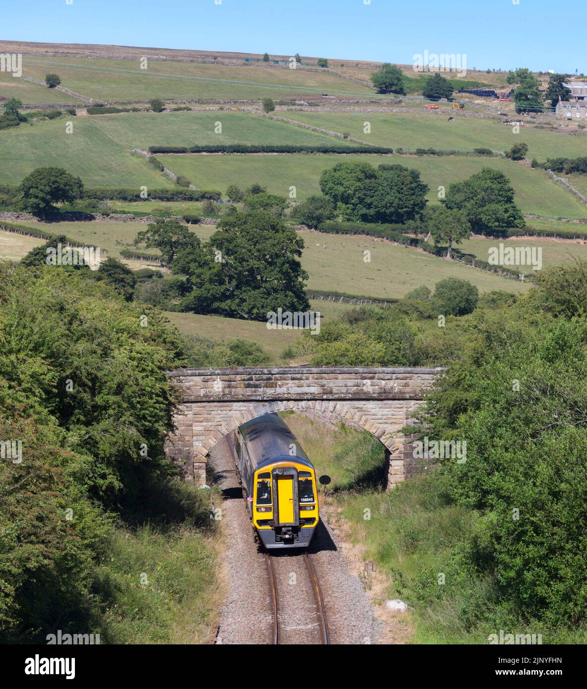 Northern Rail class 158 DMU train passing Lealholm on the rural scenic ...