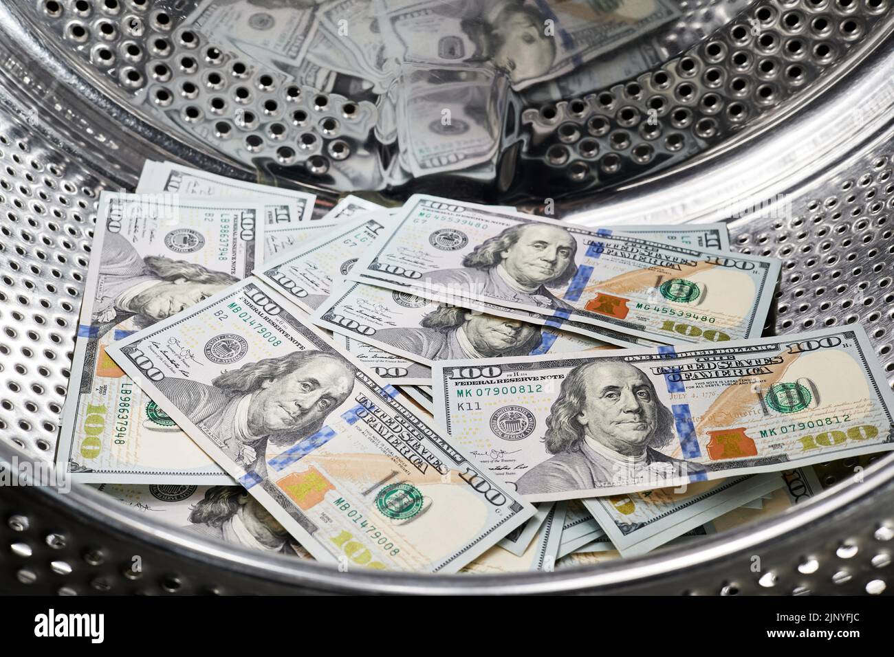 Close-up of washing dollars in machine, money laundering, financial ...