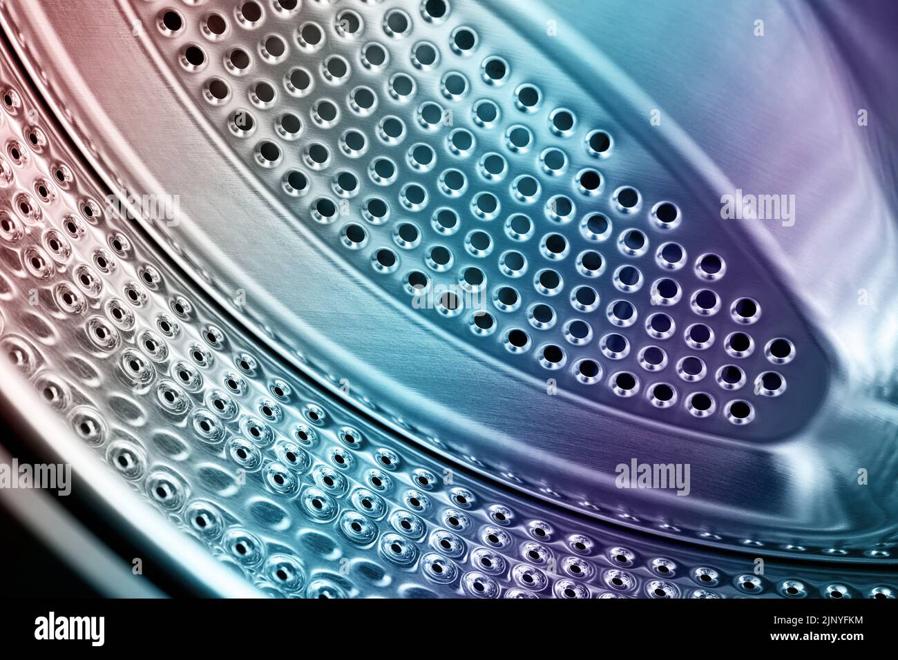 Close-up of inside of a steel washing machine drum Stock Photo - Alamy