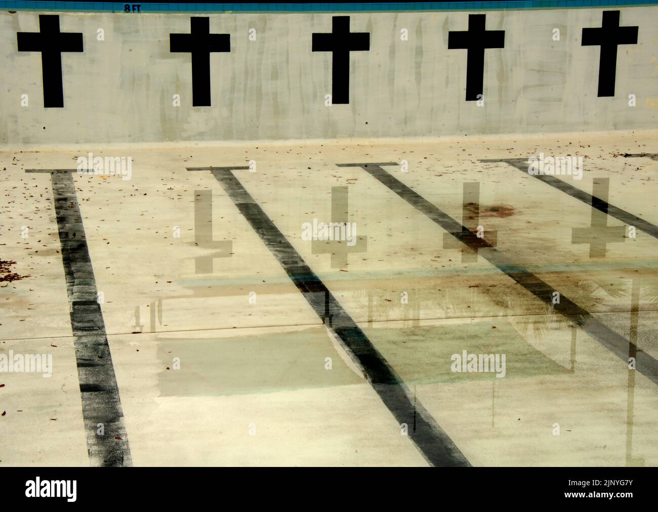 Empty swimming pool crosses with reflections Stock Photo - Alamy