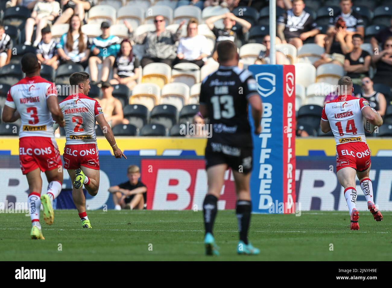 Joey Lussick #14 of St Helens sees a clear way all the way to the try ...
