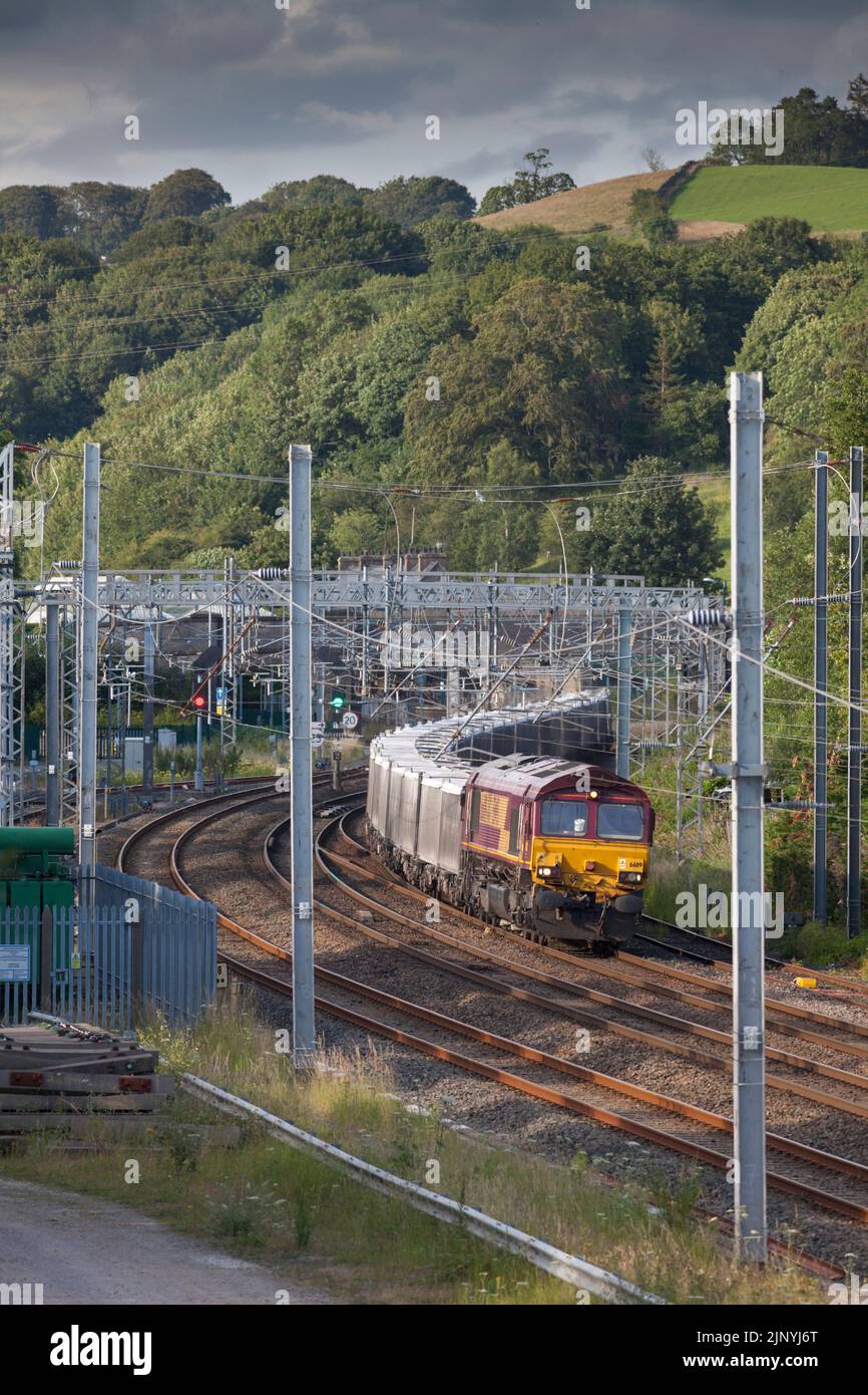 DB Cargo Rail UK class 66 diesel locomotive hauling a freight train on ...