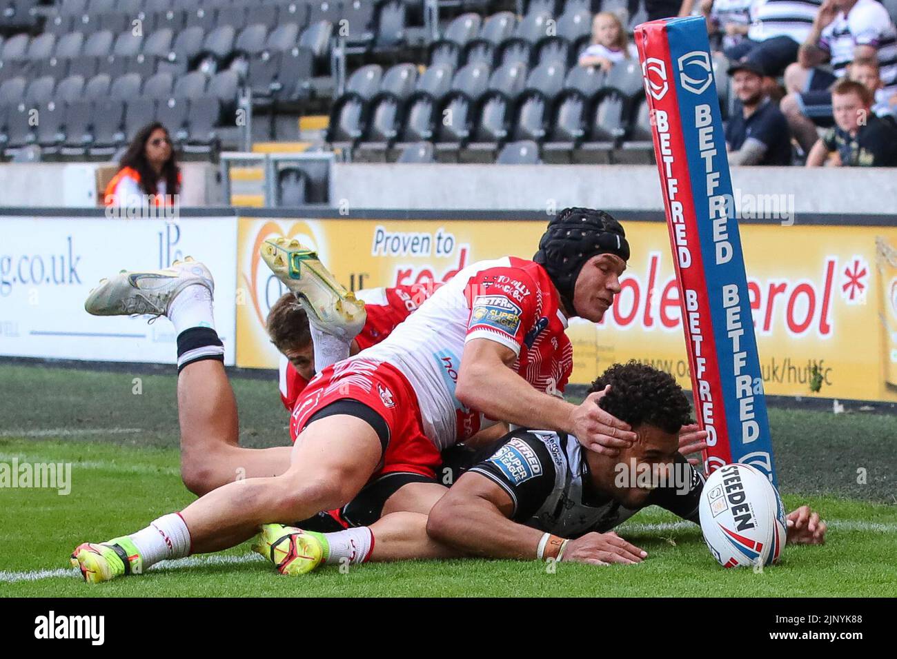 Darnell McIntosh #5 of Hull FC loses the ball and receives an injury ...