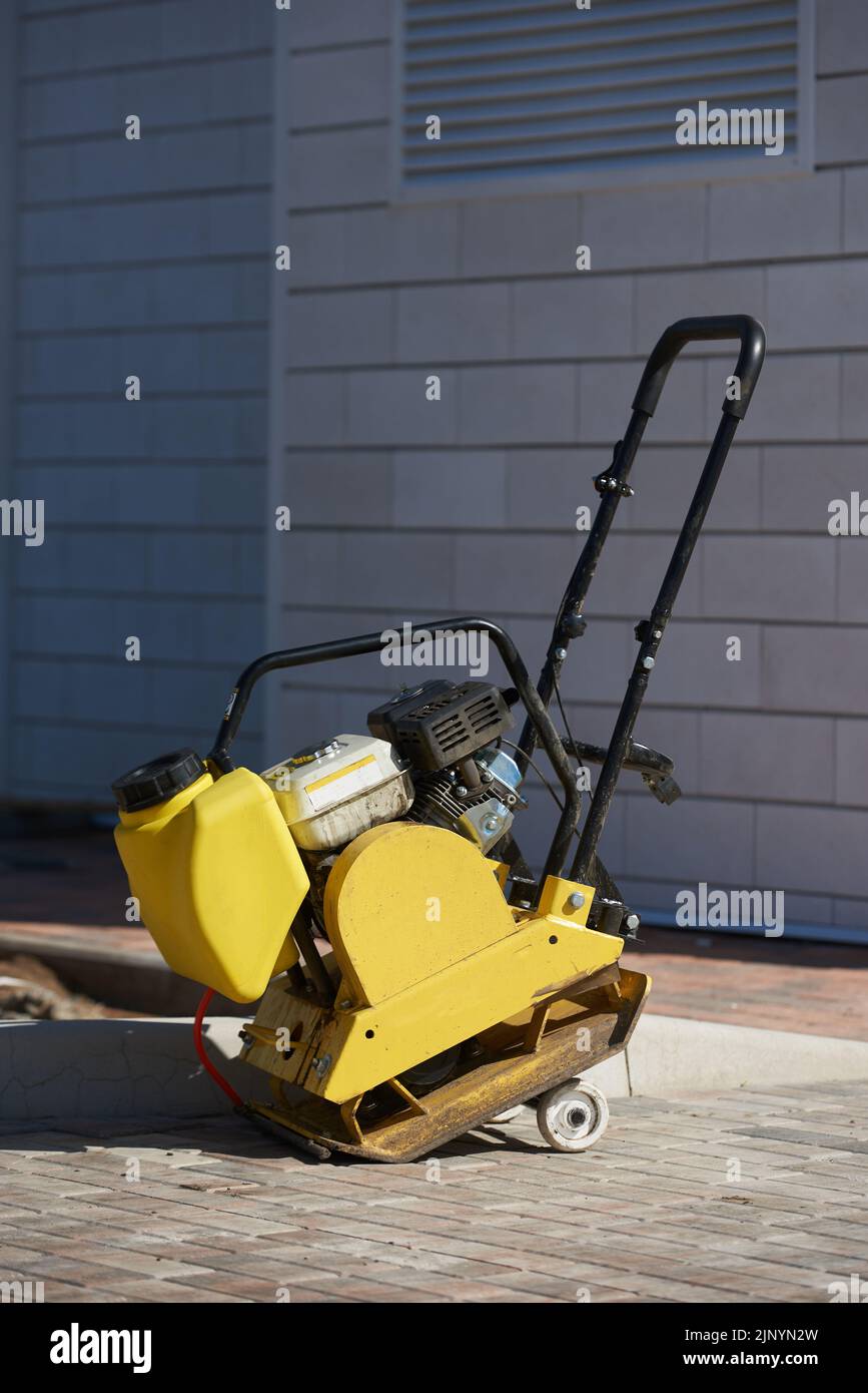 Vibrating plate for compacting ground and sand, Construction equipment ...