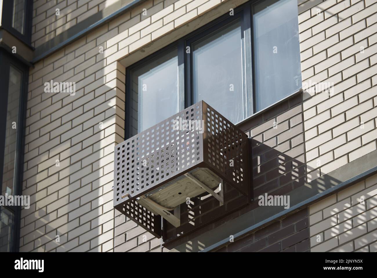 Building with decorative air conditioner covers Stock Photo - Alamy