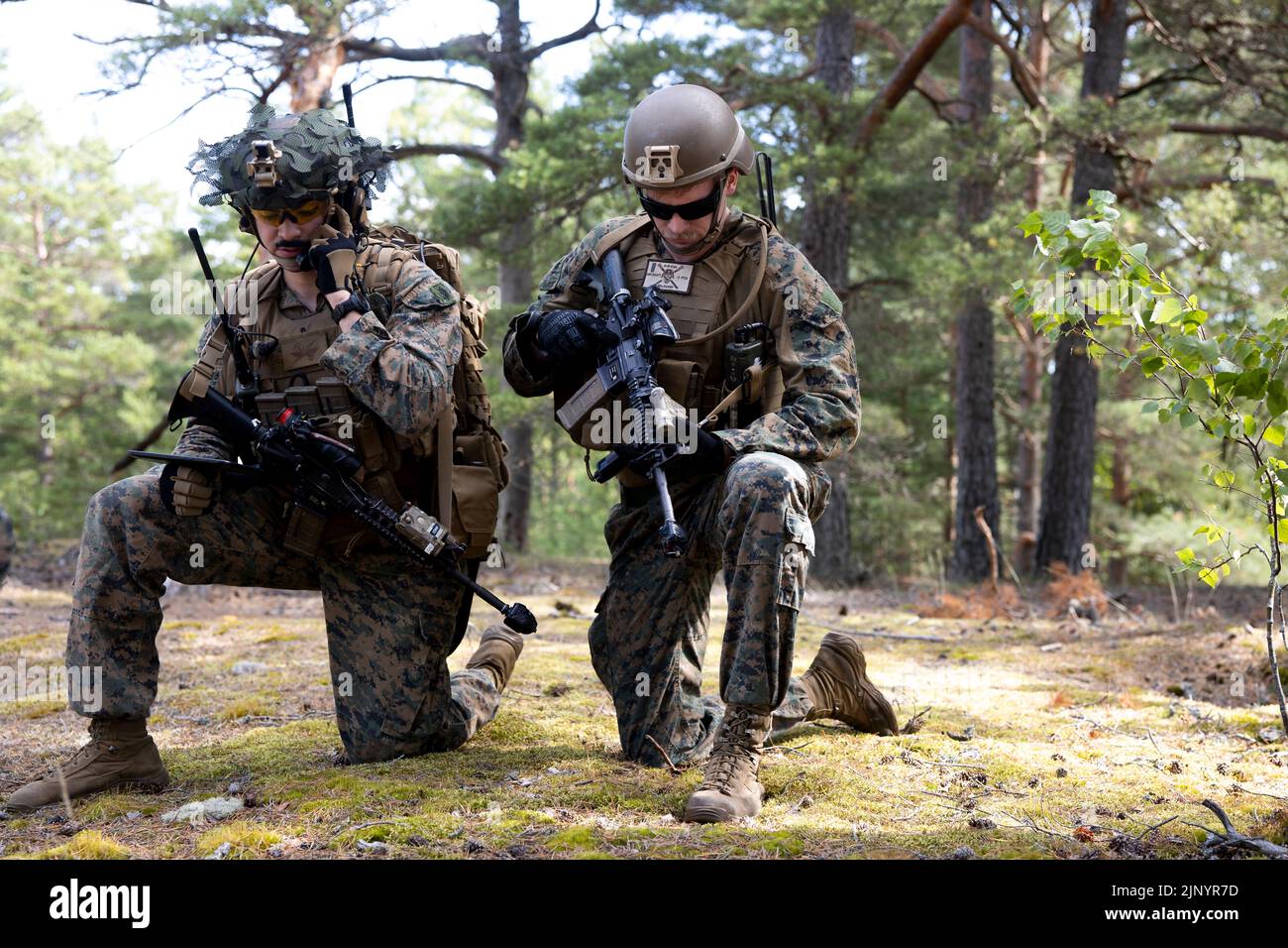 U.S. Marine Corps Staff Sgt Jesus Meraz, left, a fire control ...