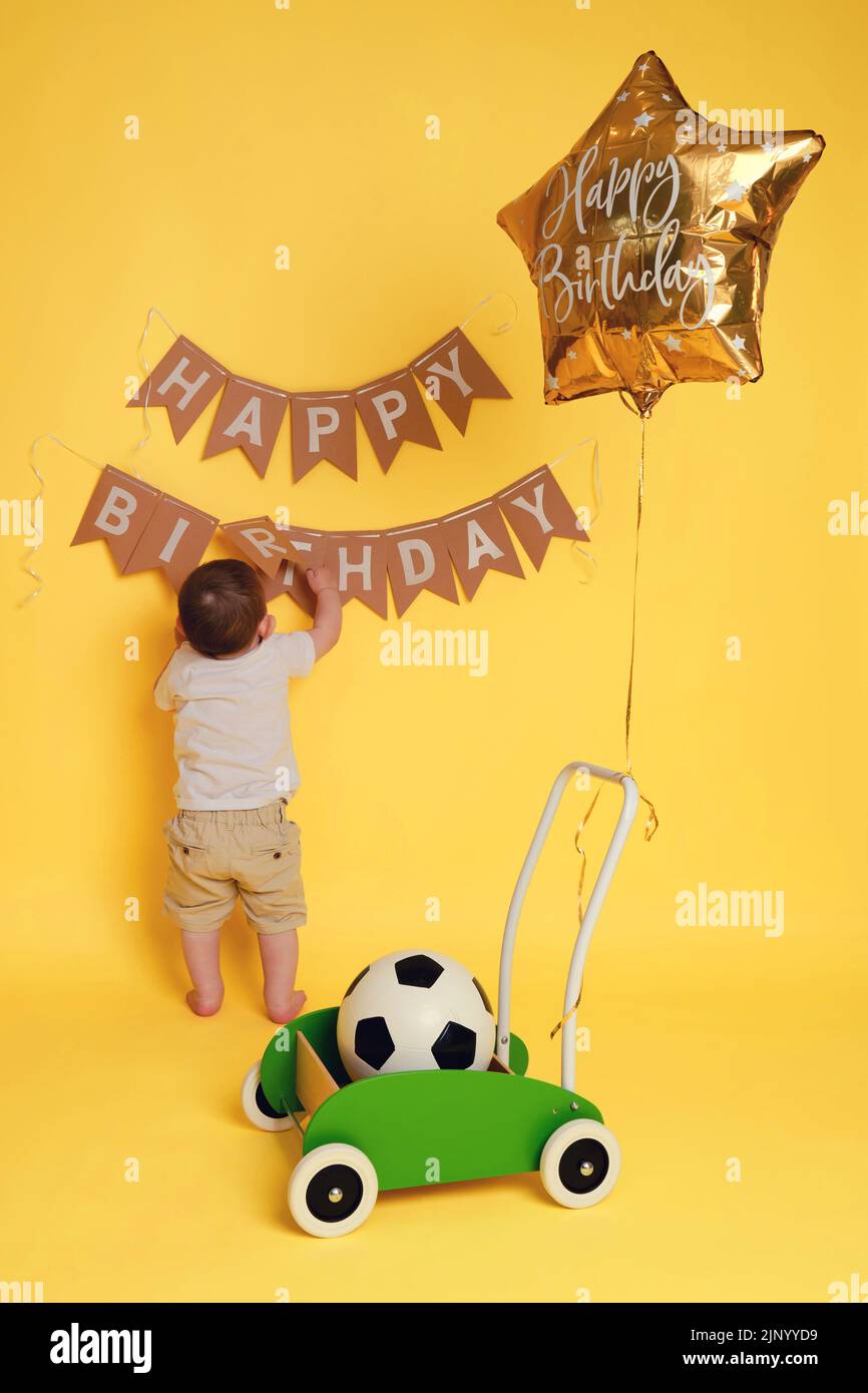 Decorations on a studio yellow background for celebrating the first ...