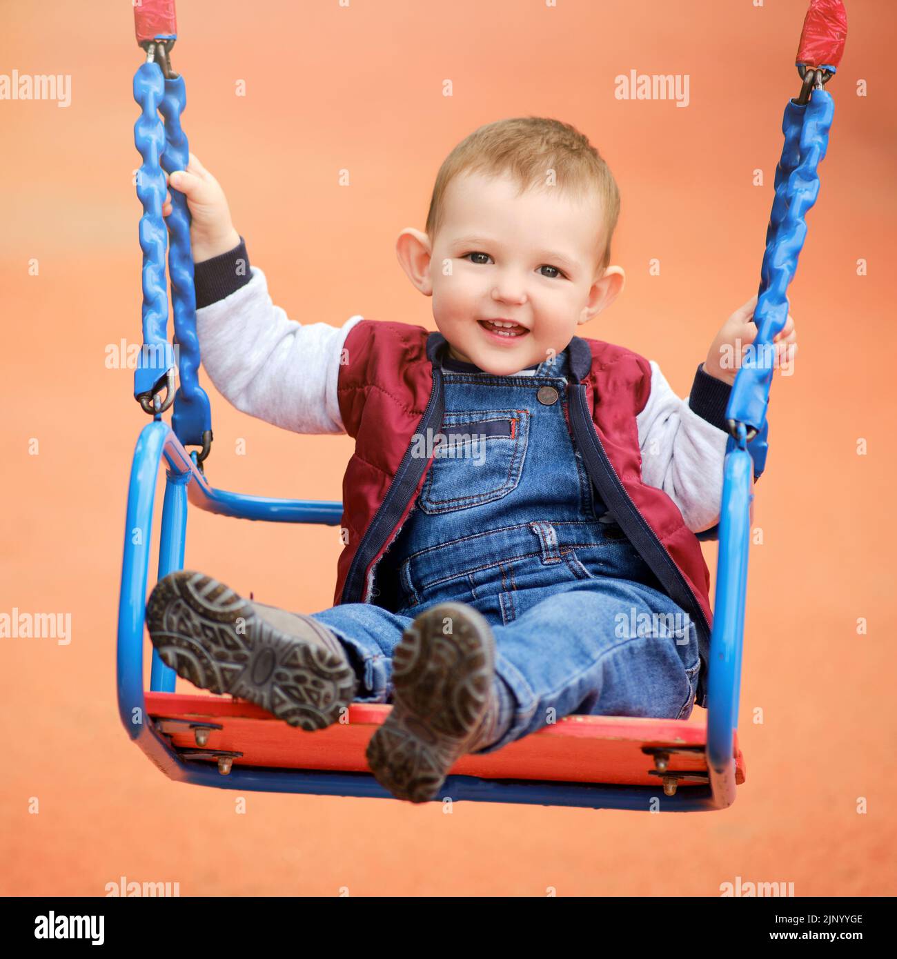 Happy baby rides on swing hi-res stock photography and images - Alamy