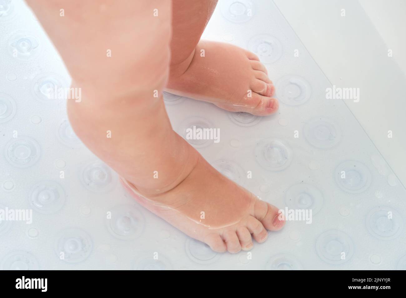 Boy standing wet floor hi-res stock photography and images - Alamy