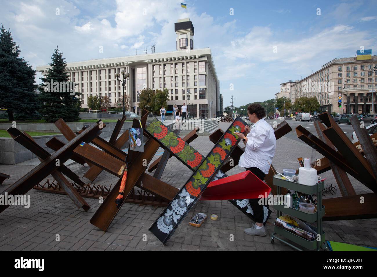 An artist paints anti-tank hedgehog barricades in central Kyiv Stock ...