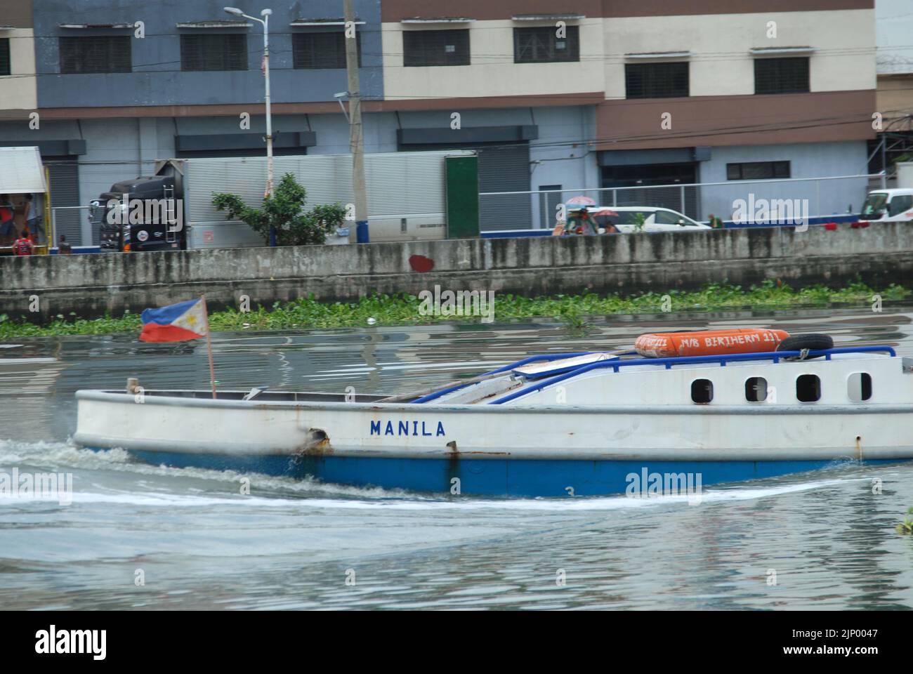 Boat crossing Pasig River, Manila, Philippines Stock Photo - Alamy