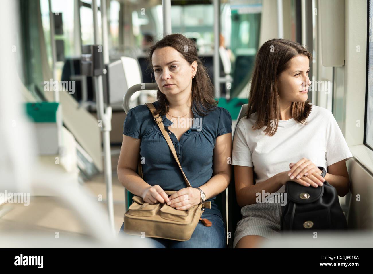 Passengers ride together on a bus or tram Stock Photo - Alamy