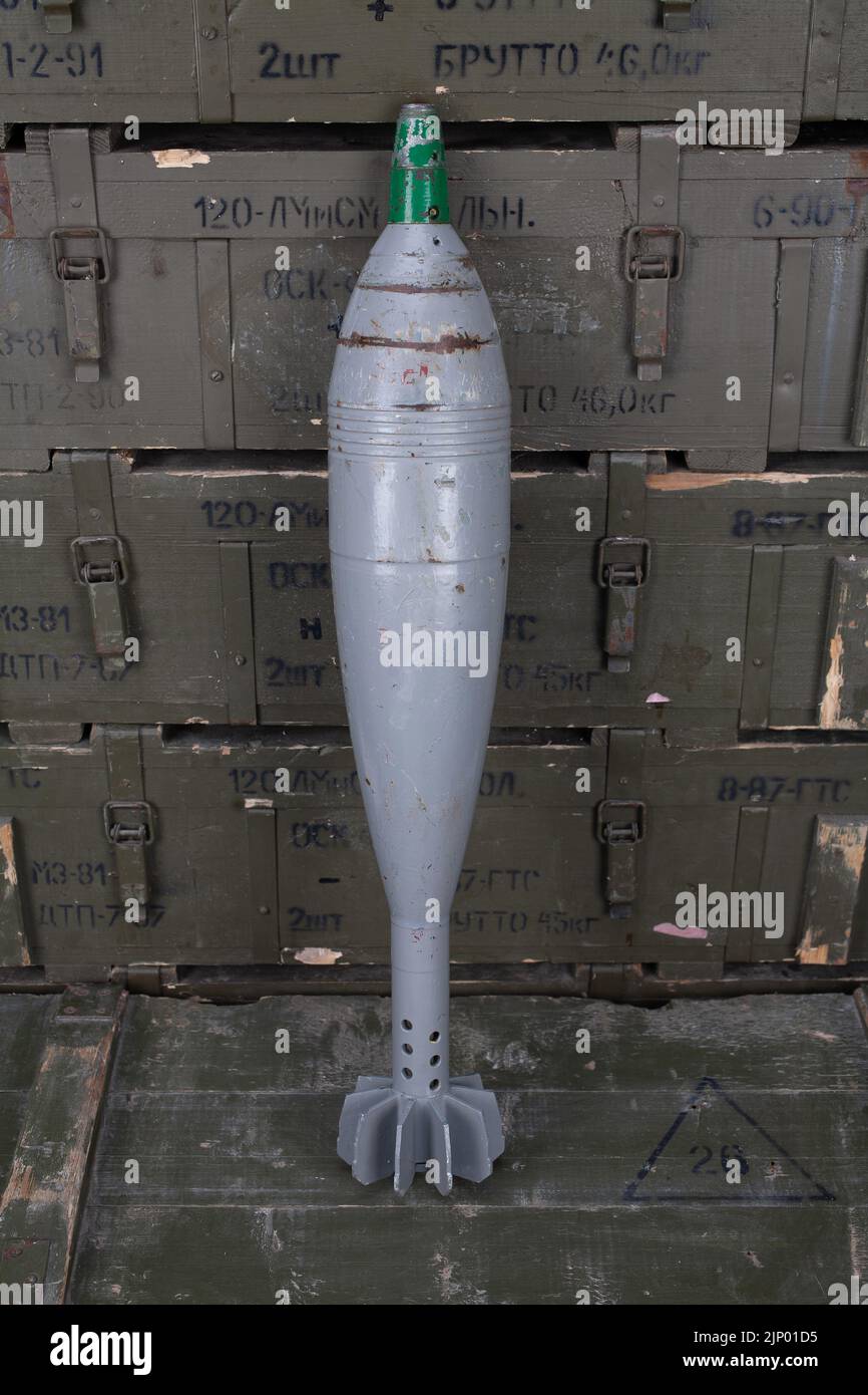 Soviet or russian 120 mm mortar shell on army green crate. Text in ...