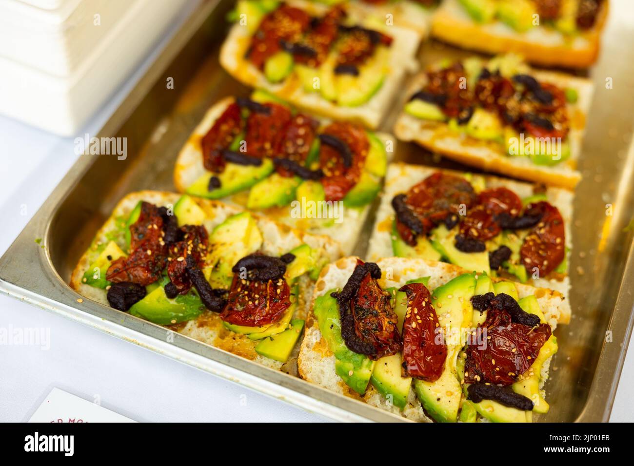 Sandwiches with avocado, fig jam and stewed peppers Stock Photo - Alamy