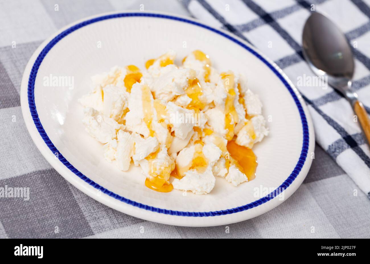 Soft whey cheese mato from goat milk with honey Stock Photo - Alamy