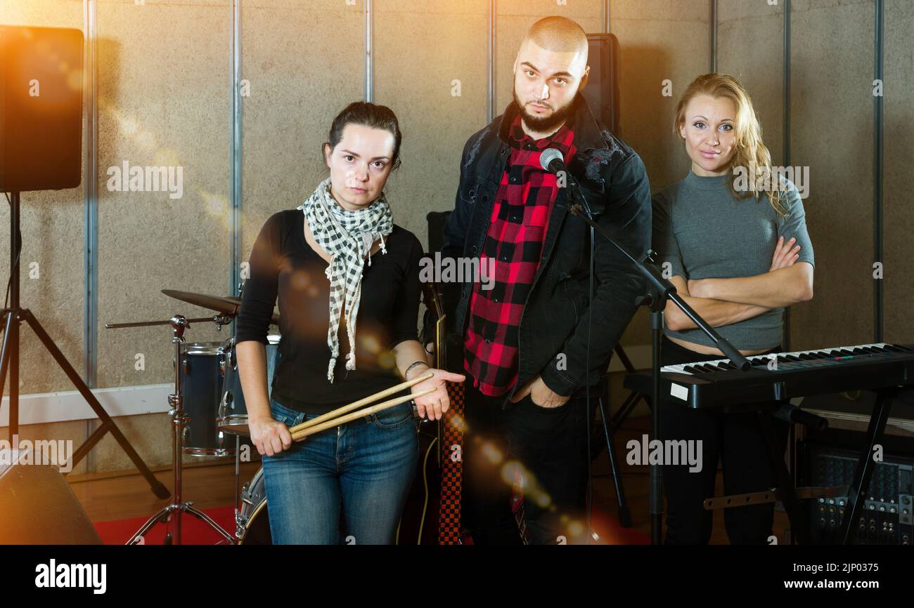 Guitarist, drummer and keyboardist of rock band Stock Photo - Alamy