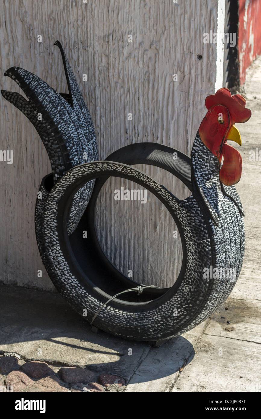 Rooster made out of an old car tire Stock Photo - Alamy