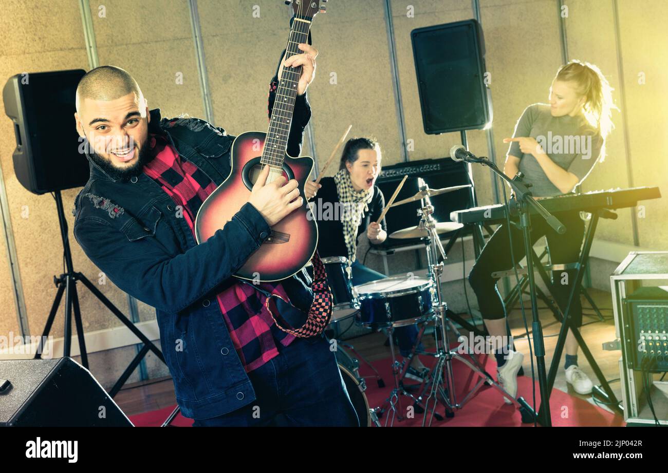 Band singer drummer electric guitar hi-res stock photography and images ...