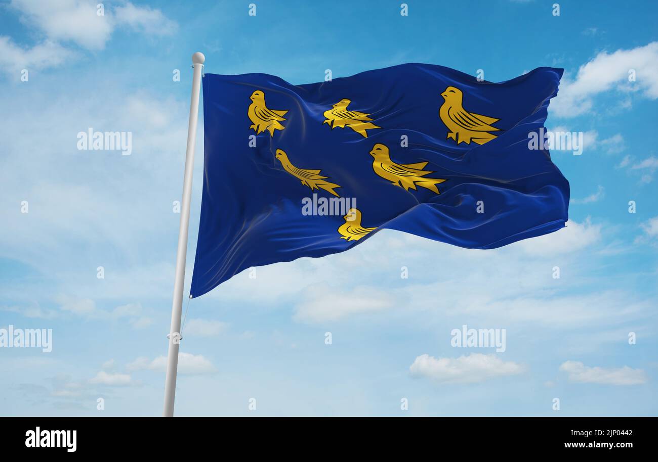 flag of Anglo-Frisian peoples Sussex people at cloudy sky background ...