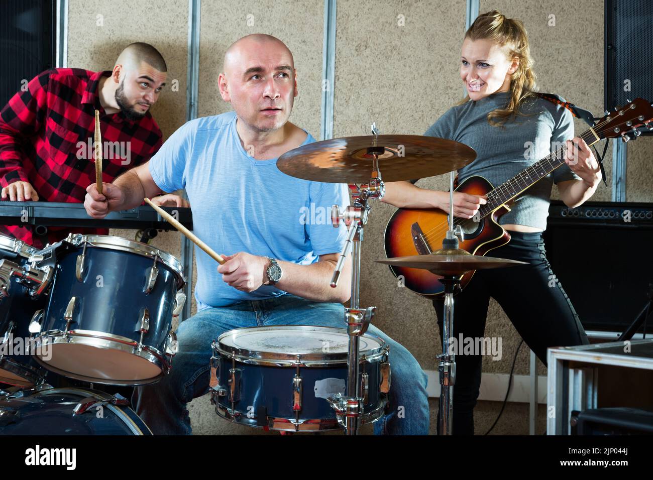 Band members rehearsing in studio hi-res stock photography and images ...