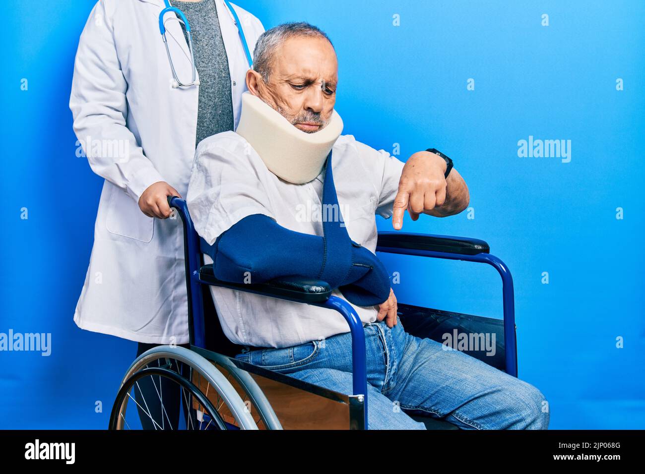 Handsome senior man with beard sitting on wheelchair with neck collar ...