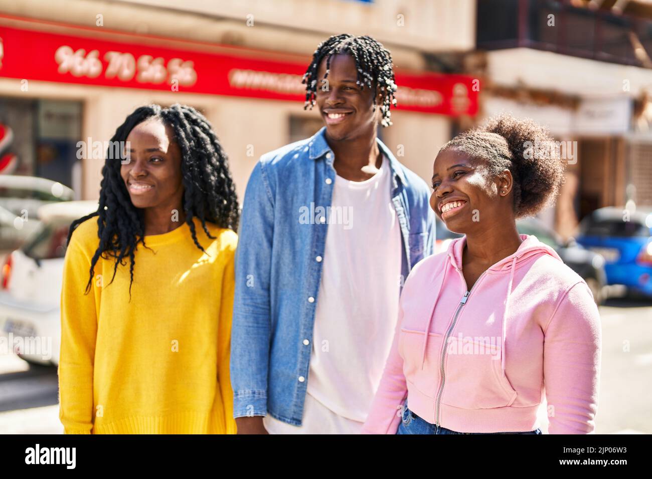 African american friends smiling confident standing together at street ...