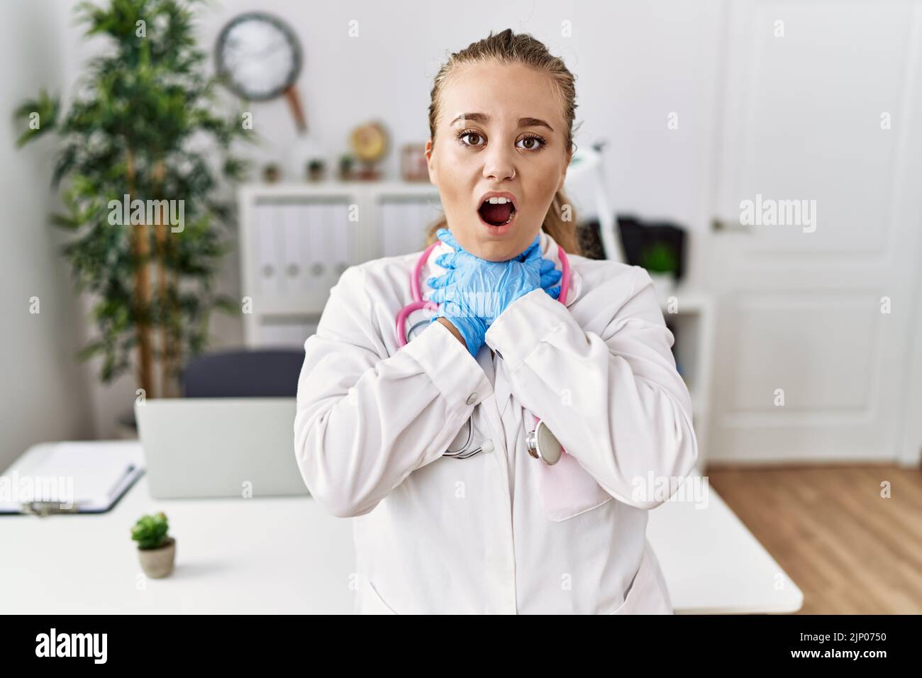 Young caucasian woman wearing doctor uniform and stethoscope at the ...
