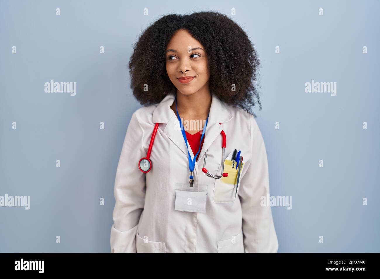 Young african american woman wearing doctor uniform and stethoscope ...
