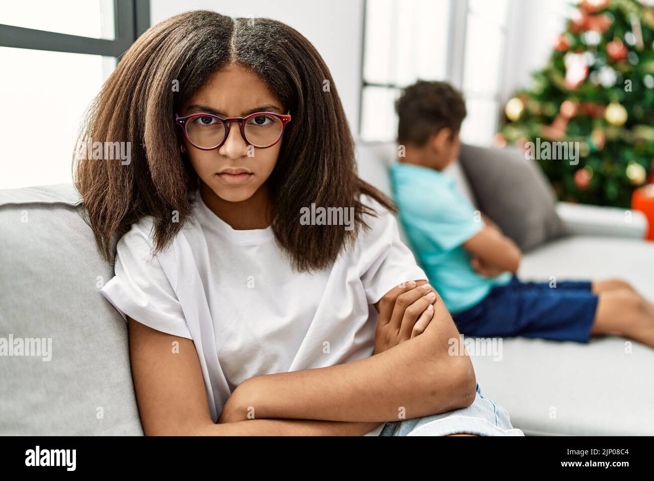 Brother and sister angry having problem sitting on sofa at home Stock ...