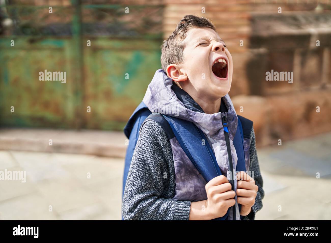 Blond child student screaming at street Stock Photo - Alamy
