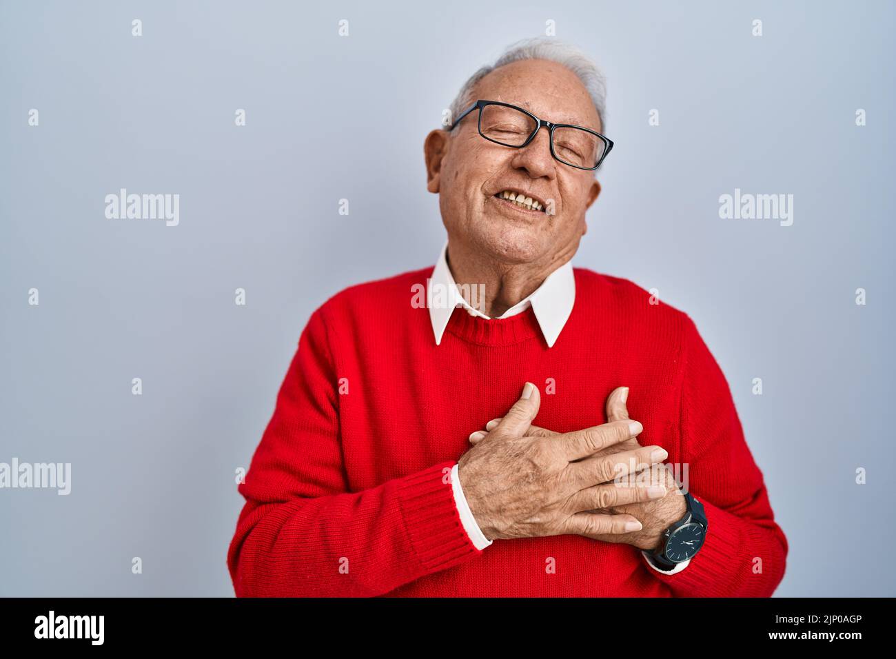 Senior man with grey hair standing over isolated background smiling ...