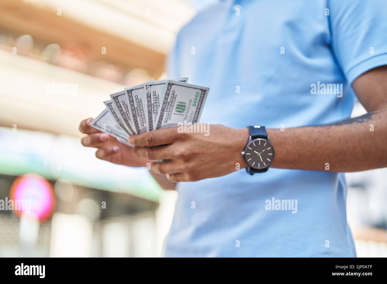 African american man counting dollars at street Stock Photo - Alamy