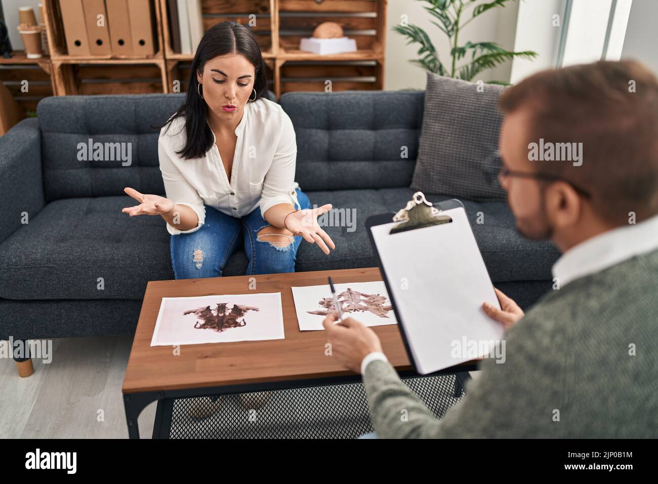 Man and woman psychology and patient doing rorschach test having ...
