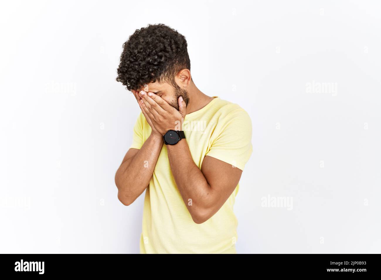 Arab young man standing over isolated background with sad expression ...