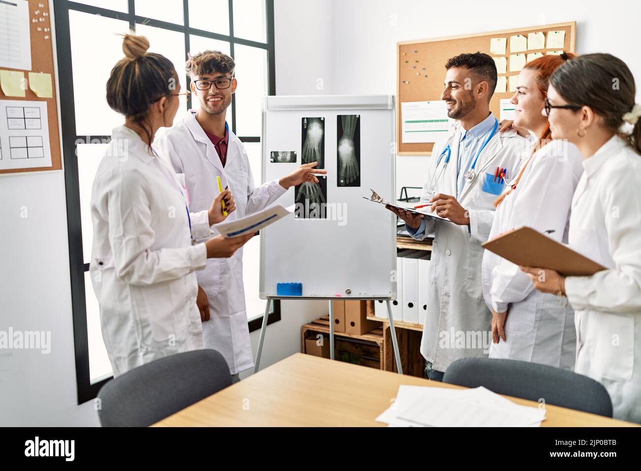 Group of young doctor discussing in a medical meeting at the clinic ...