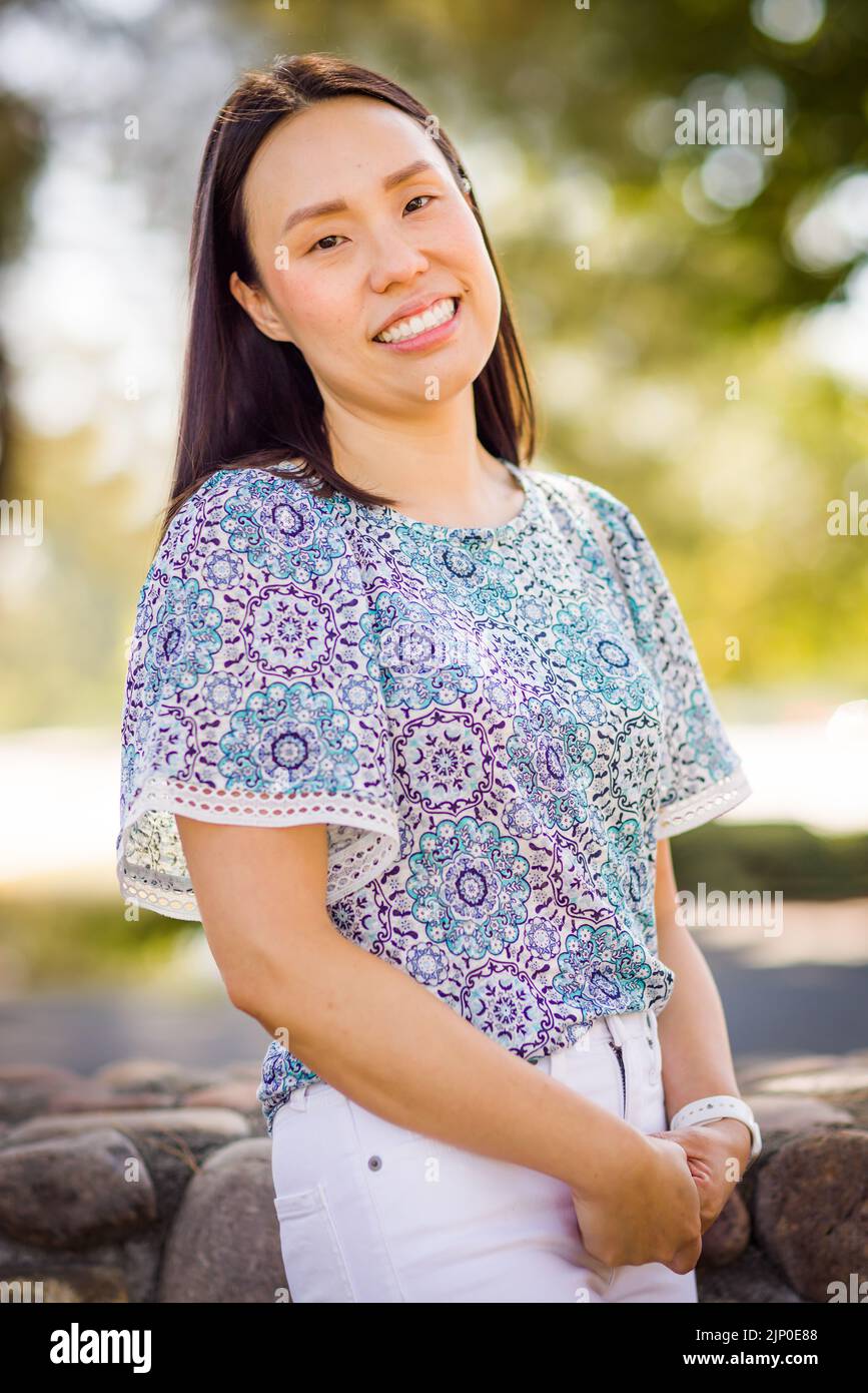 Outdoor portrait of a happy Chinese young adult woman Stock Photo - Alamy