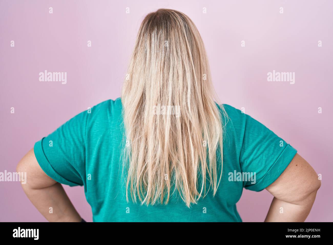 Caucasian Plus Size Woman Standing Over Pink Background Standing