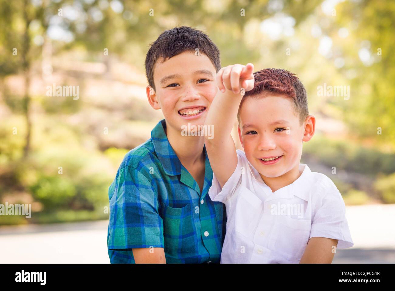Outdoor portrait of mixed race Chinese and Caucasian brothers Stock ...